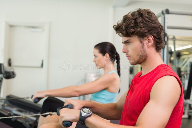 Focused Man Working Out on the Rowing Machine Stock Image - Image of ...