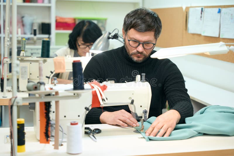 Focused Man Working on a Sewing Machine Stock Image - Image of workshop ...