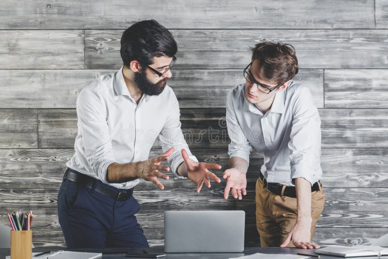 Focused men using laptop stock photo. Image of online - 98650672