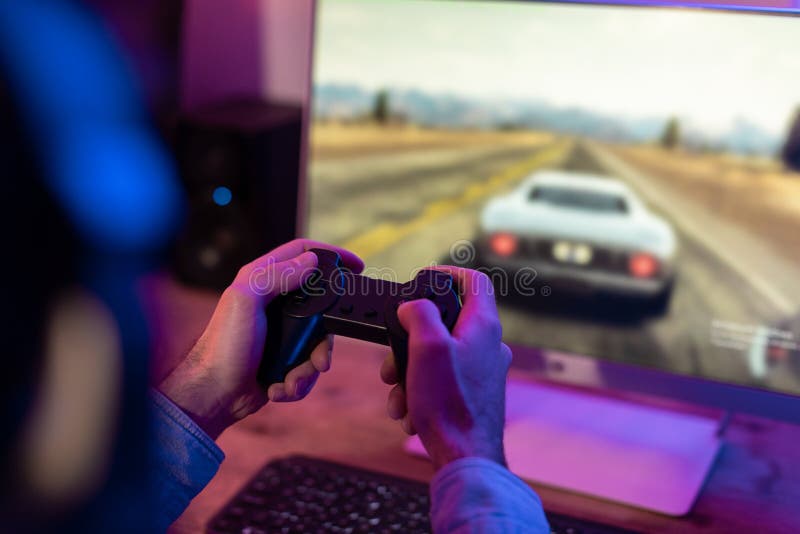 Focused Millennial Playing a Racing Game at Home Stock Image - Image of ...