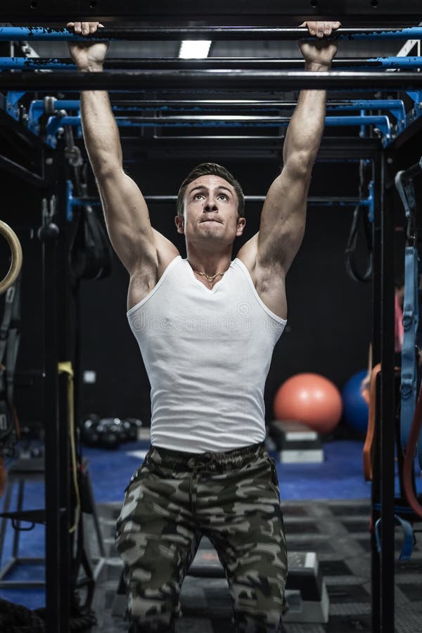 Strong Guy Doing Pull Ups in Gym Stock Image - Image of looking, male ...