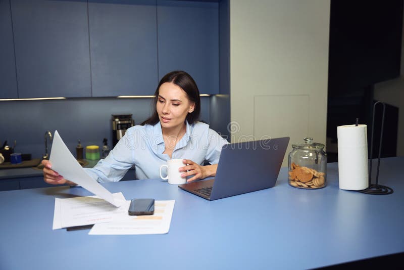 Focused Office Worker Dealing with Paperwork during Tea Break Stock ...