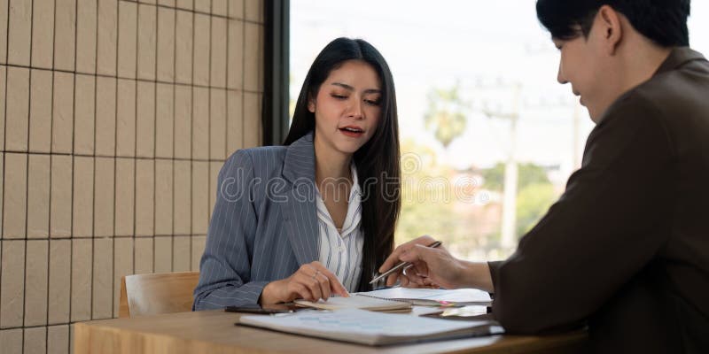 Focused Partnership. Colleagues Planning Strategy while Sharing ...