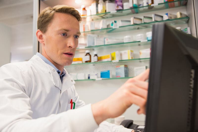 Focused Pharmacist Using the Computer Stock Photo - Image of adult ...