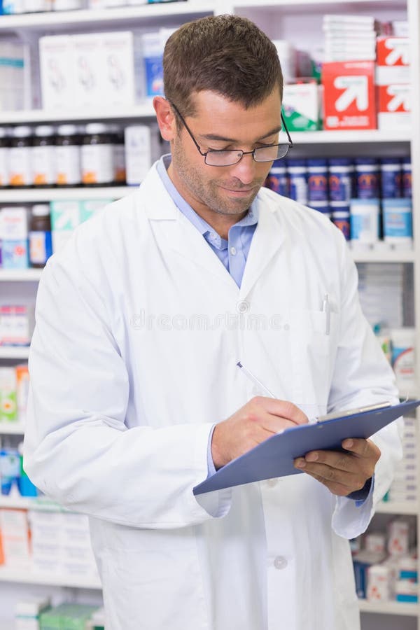 Focused Pharmacist on the Phone Taking Notes Stock Image - Image of ...