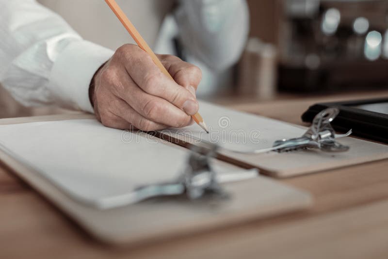 Focused Photo on Man that Writing Information Stock Photo - Image of ...