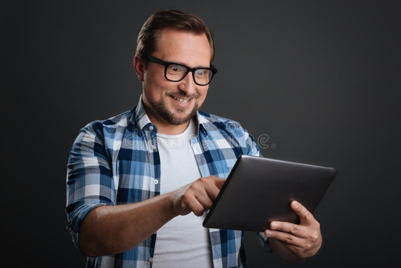 Focused Positive Man Working with His Gadget Stock Photo - Image of ...
