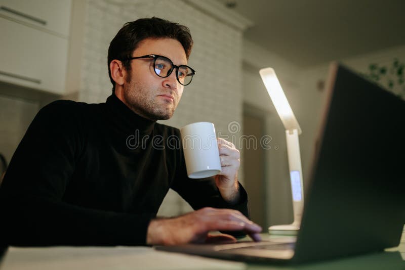 Focused and Productive Man Concentrating on Work at Home Stock Photo ...