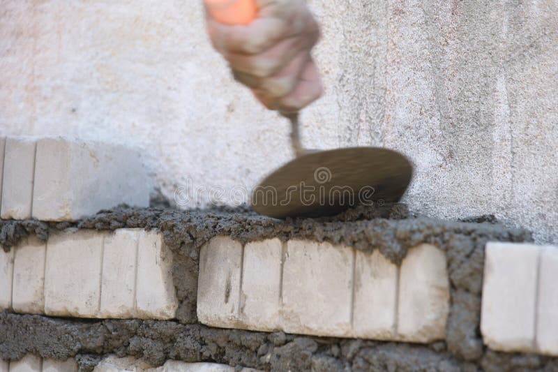 Worker Using Trowel To Put Cement Mortar on Wall Stock Photo - Image of ...
