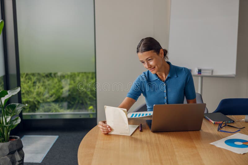 A Focused Professional Engaged in Work Activities Inside a Modern ...