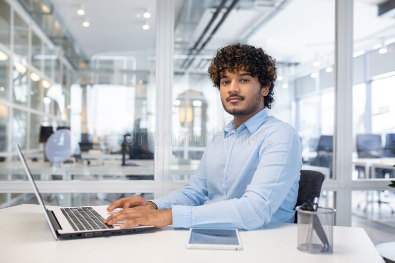 Professional Working on a Laptop in a Modern Office Space Stock Image ...