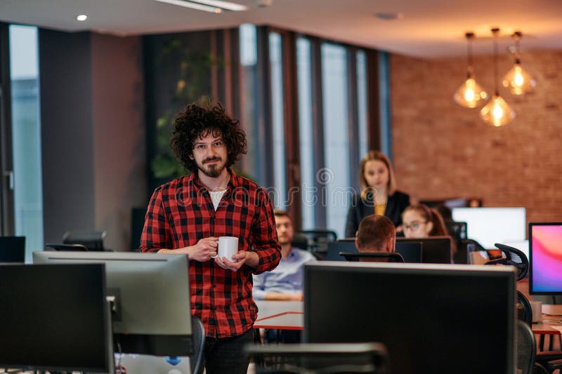 Focused Professional: Interesting Man with Coffee Cup in Office ...