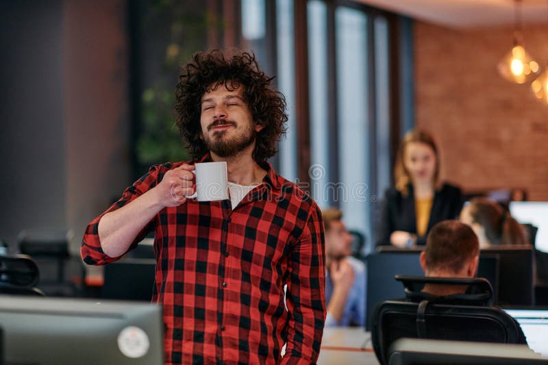 Focused Professional: Interesting Man with Coffee Cup in Office ...