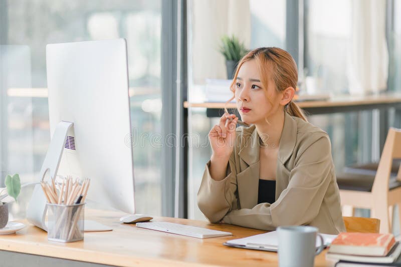 A Focused and Professional Millennial Asian Graphic Designer, Woman ...