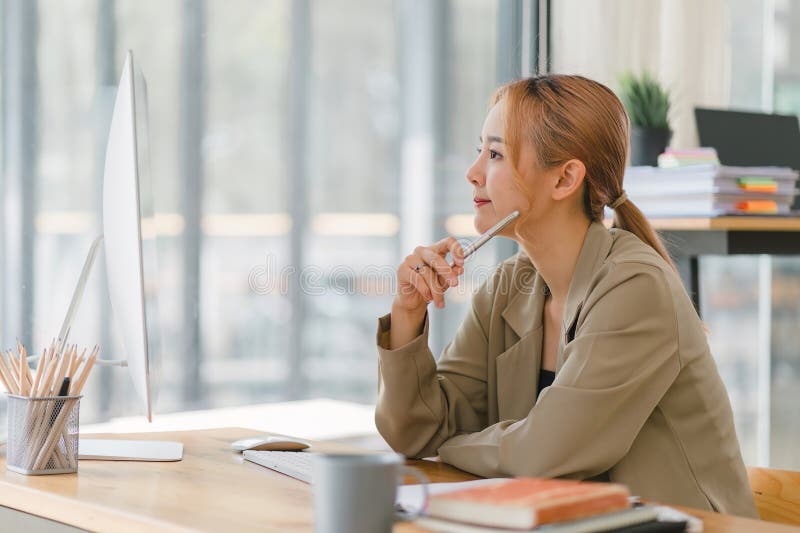 A Focused and Professional Millennial Asian Graphic Designer, Woman ...