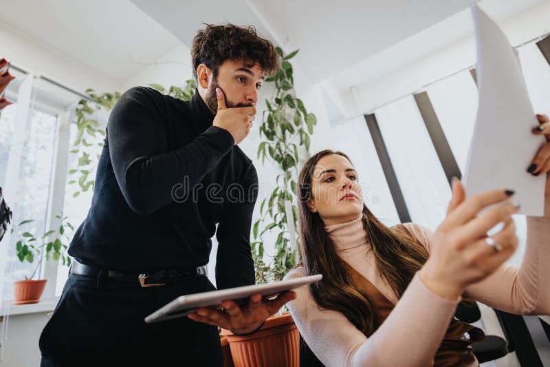 Focused Professionals in a Creative Brainstorming Session with ...