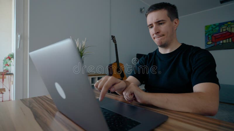 Focused Programmer Develops New Game on Laptop at Home Stock Footage ... Focused Programmer Develops New Game on Laptop at Home Stock Footage ...