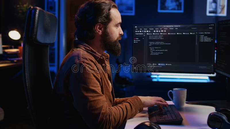 Focused Programmer Drinking Coffee In Apartment While Solving Database Errors Stock Video