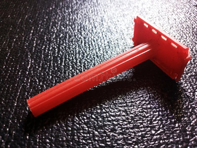 Focused Red Razor on Black Wrinkled Surface Stock Photo - Image of ...