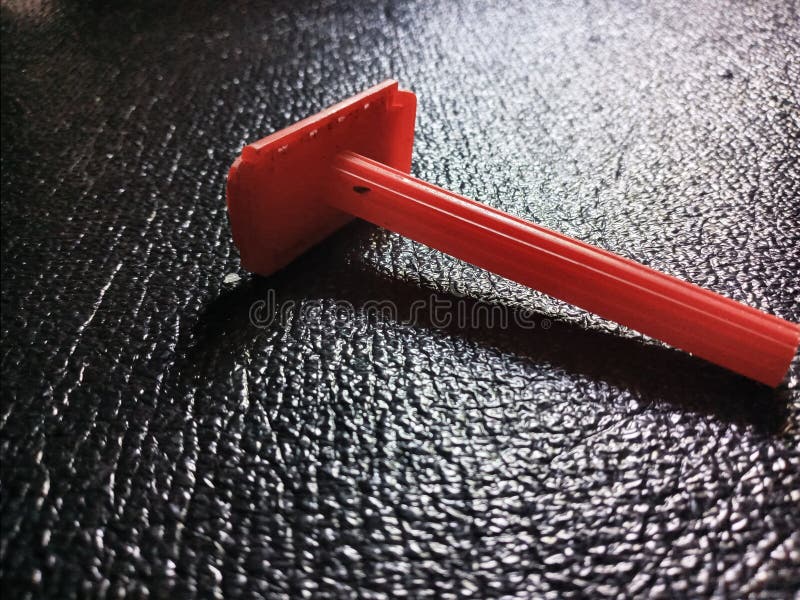 Focused Red Razor on Black Wrinkled Surface Stock Image - Image of ...