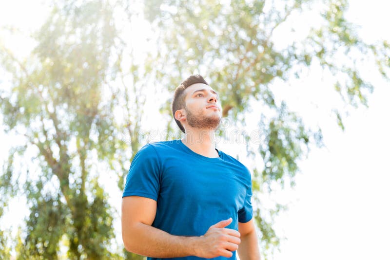Focused Runner Practicing Running in Park on Sunny Day Stock Image ...