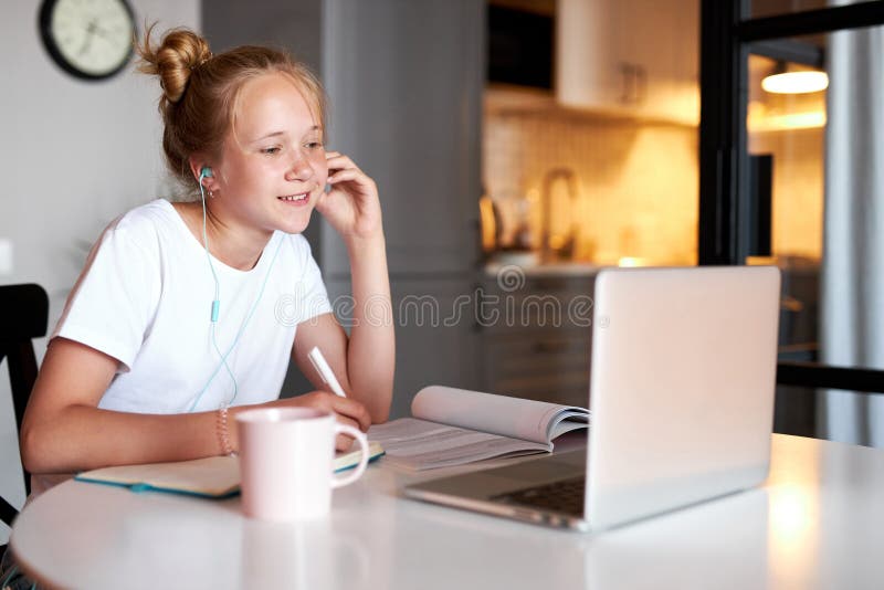 Focused School Girl Preparing Project on Notebook at Home Stock Photo ...