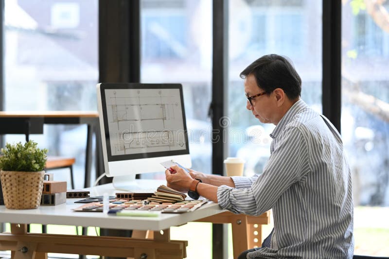 Focused Senior Interior Designer Working at Modern Creative Office ...