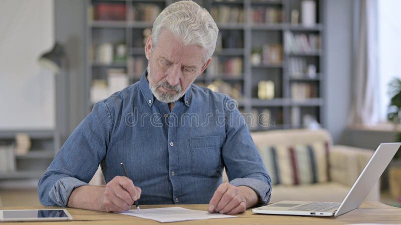 Focused Senior Old Man Reading Documents in Office Stock Photo - Image ...