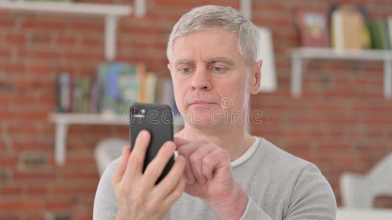 Focused Old Man Using Smartphone Stock Photo - Image of businessman ...