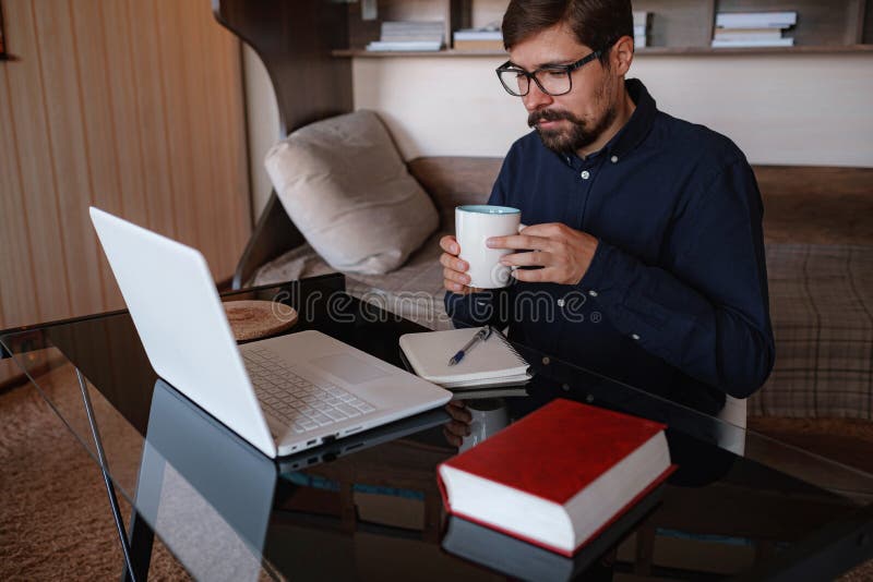 Focused Serious Male Student Using Laptop Looking at Computer Screen ...
