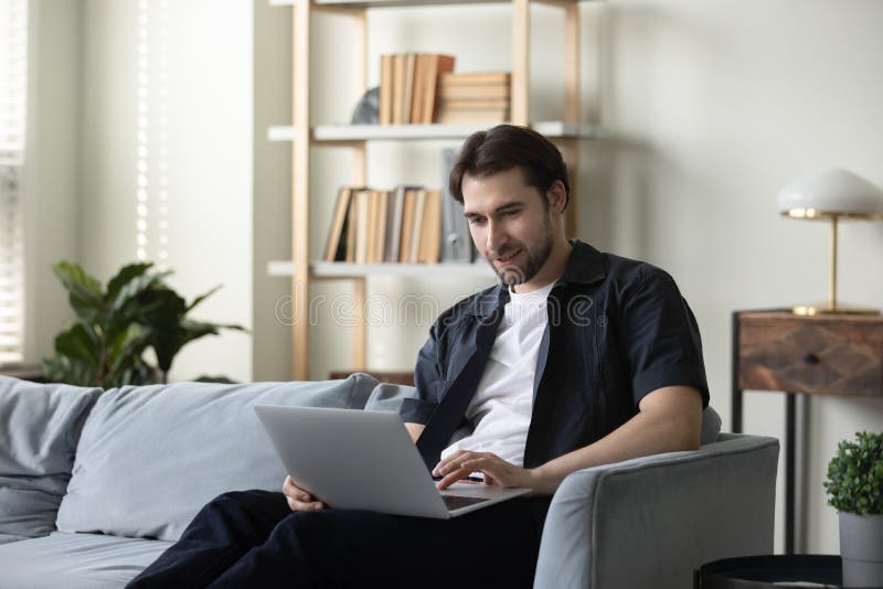 Focused Smiling Computer User Guy Working at Home Stock Photo - Image ...