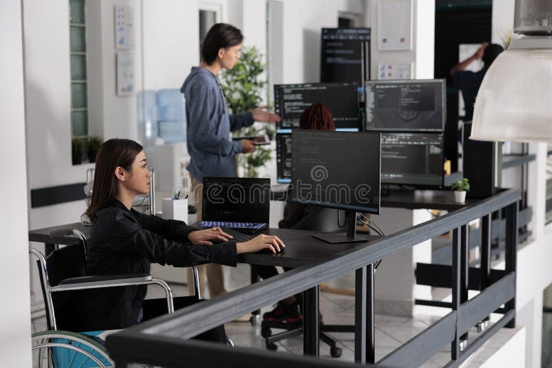 Focused Software Developer in Wheelchair Writing Server Code Stock ... Focused Software Developer in Wheelchair Writing Server Code Stock ...