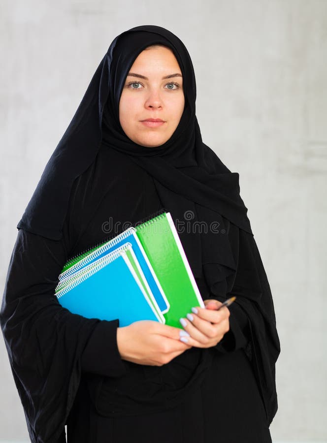 Focused Student Girl with Stack of Large Multicolored Notebooks. Stock ...