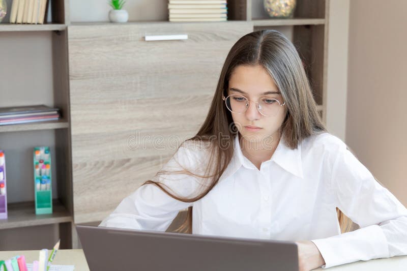 Focused Student Working on Laptop. a Focused Student Works on Her ...