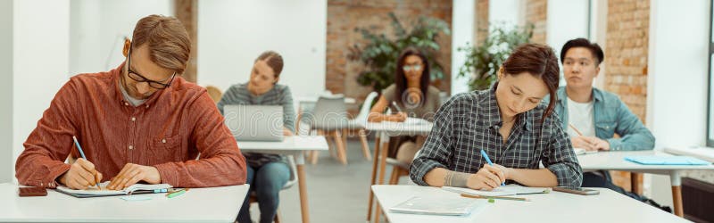 Group of University Students Taking a Test Stock Photo - Image of care ...