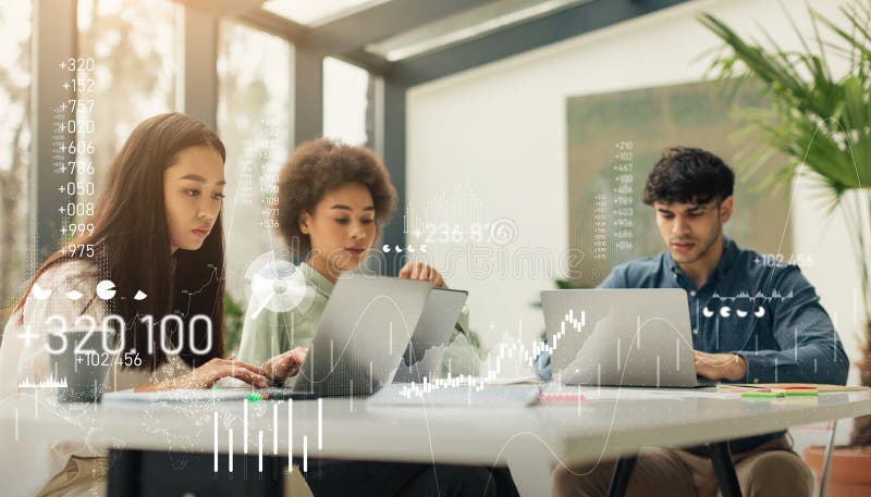 Focused Team of Young Professionals Working on Laptops and Tablets in a ...