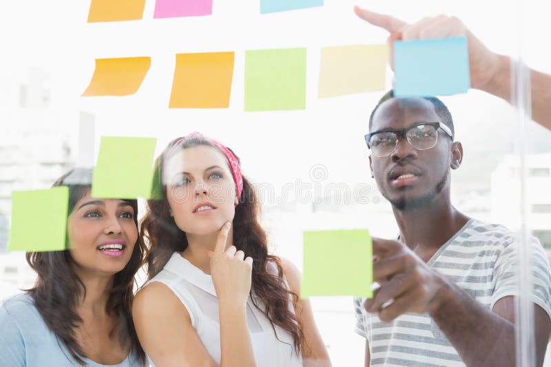 Focused Teamwork Reading Sticky Notes Stock Photo - Image of occupation ...