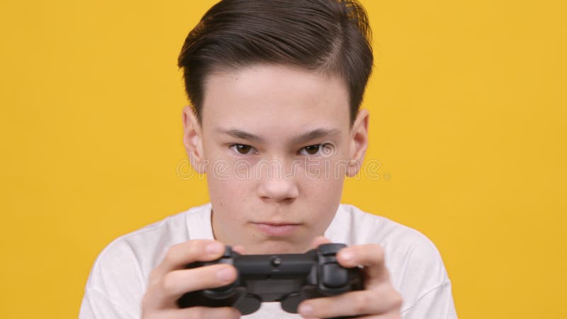 Teen Boy Focused Playing Video Games with a Portable Game Console Stock ...