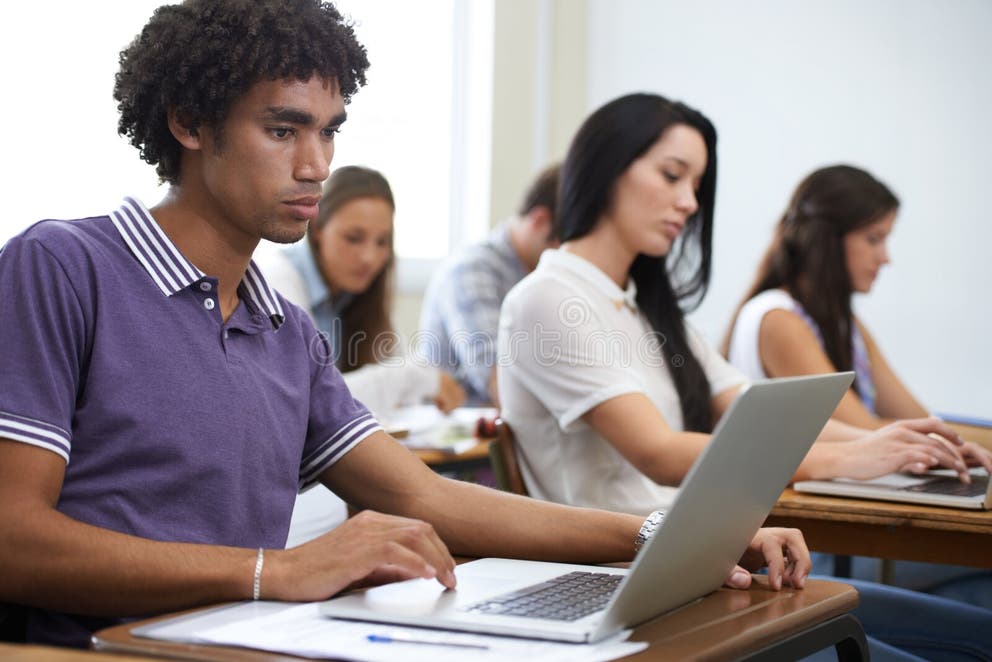 Focused on Their Assignments. a Group of University Students Working on ...