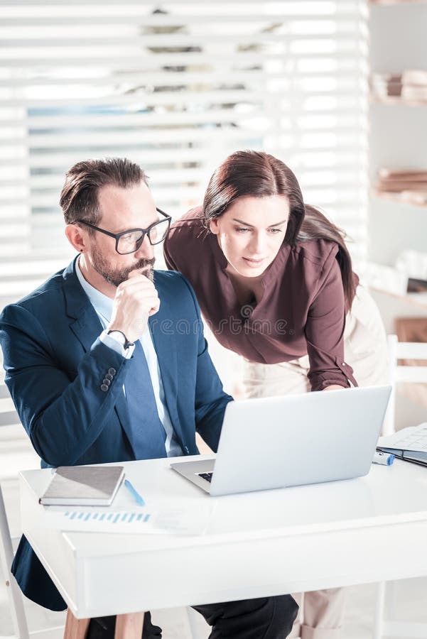 Focused Two Colleagues Joining Efforts Stock Image - Image of ...