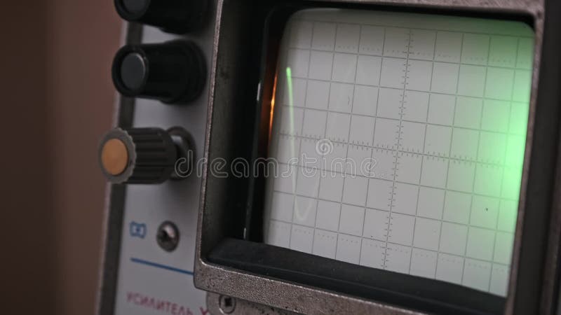 Close Up of Oscilloscope Screen with Green Signal Line Stock Video ...