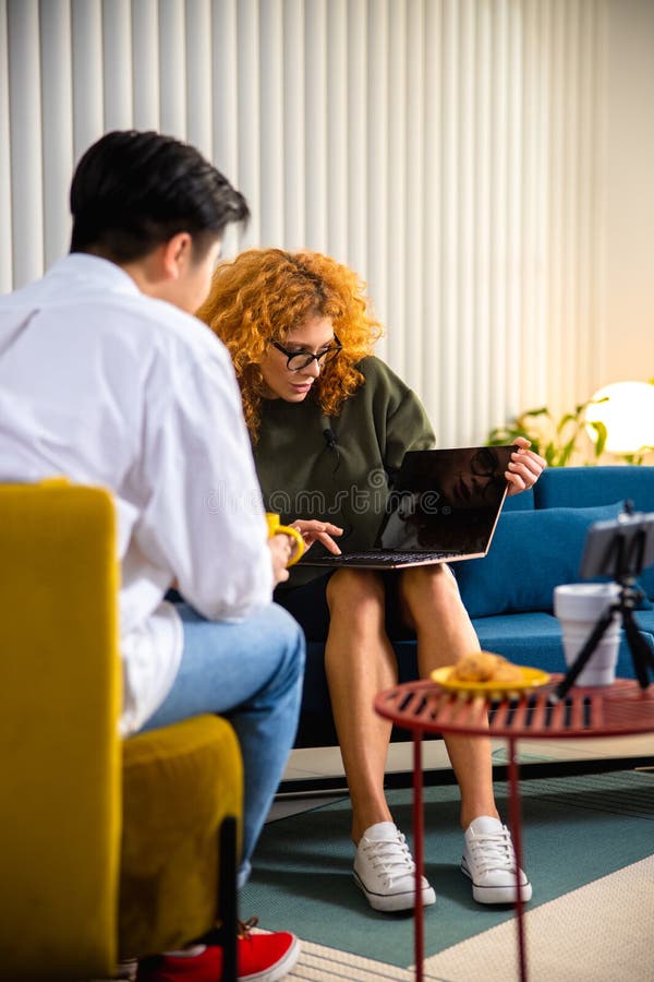 Focused Woman Looking at Laptop during an Interview Stock Image - Image ... Focused Woman Looking at Laptop during an Interview Stock Image - Image ...
