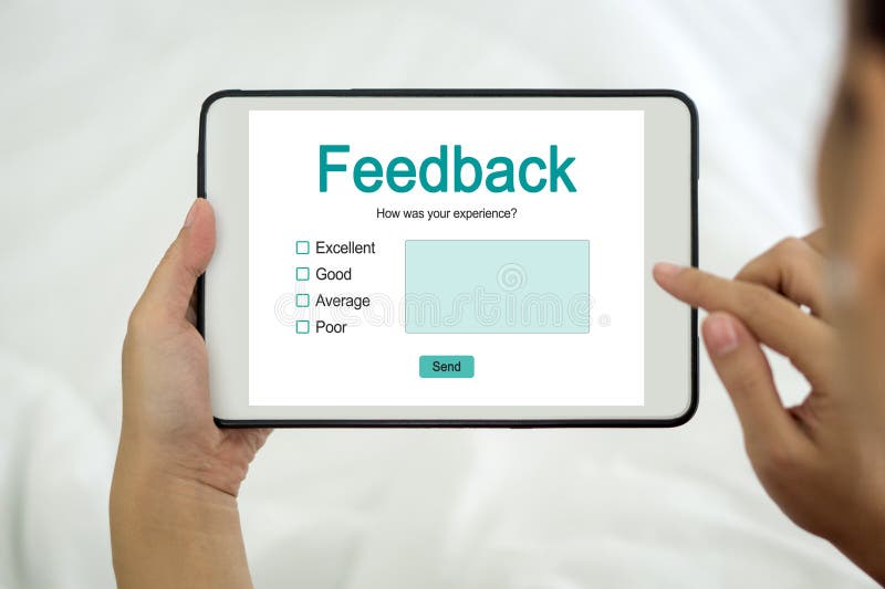 A Focused Woman is Using Her Tablet Computer, Displaying the Screen ...