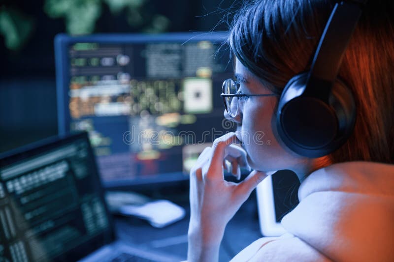 Looking at Screens. Young Professional Female Hacker is Indoors by ...