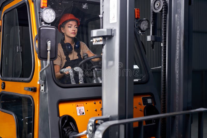 Focused Worker Driving Loader in Industrial Container Warehouse ...