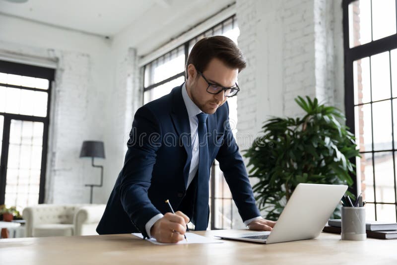 Focused Young Businessman Working at Laptop Computer Stock Image ...