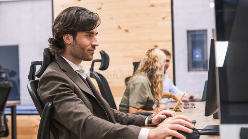 Focused Young Businessman Using Desktop PC in Creative Office Stock ...