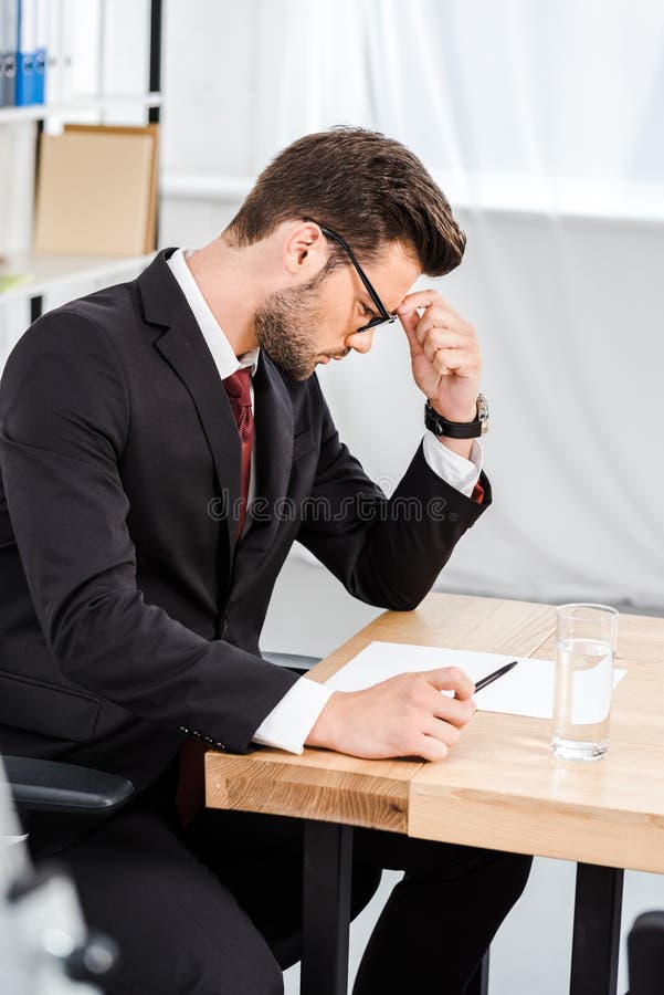 Focused Young Businessman Working Alone Stock Photo - Image of ... Focused Young Businessman Working Alone Stock Photo - Image of ...