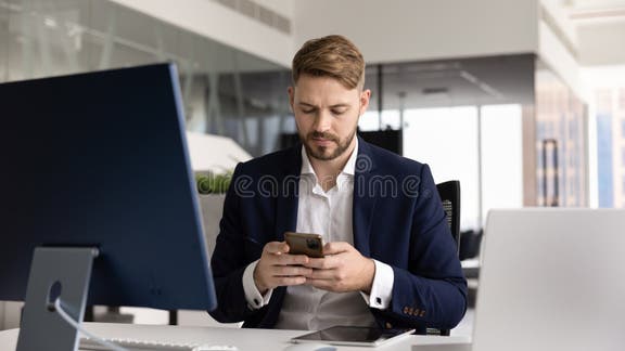 Focused Young CEO Man Using Modern Internet Technology at Workplace ...