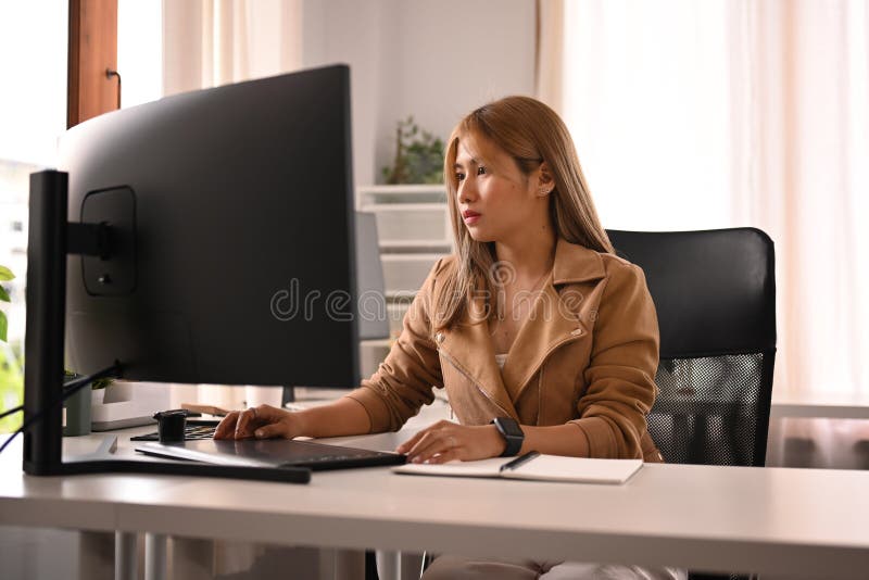 Focused Young Female Graphic Designer Working for Design Project with ...